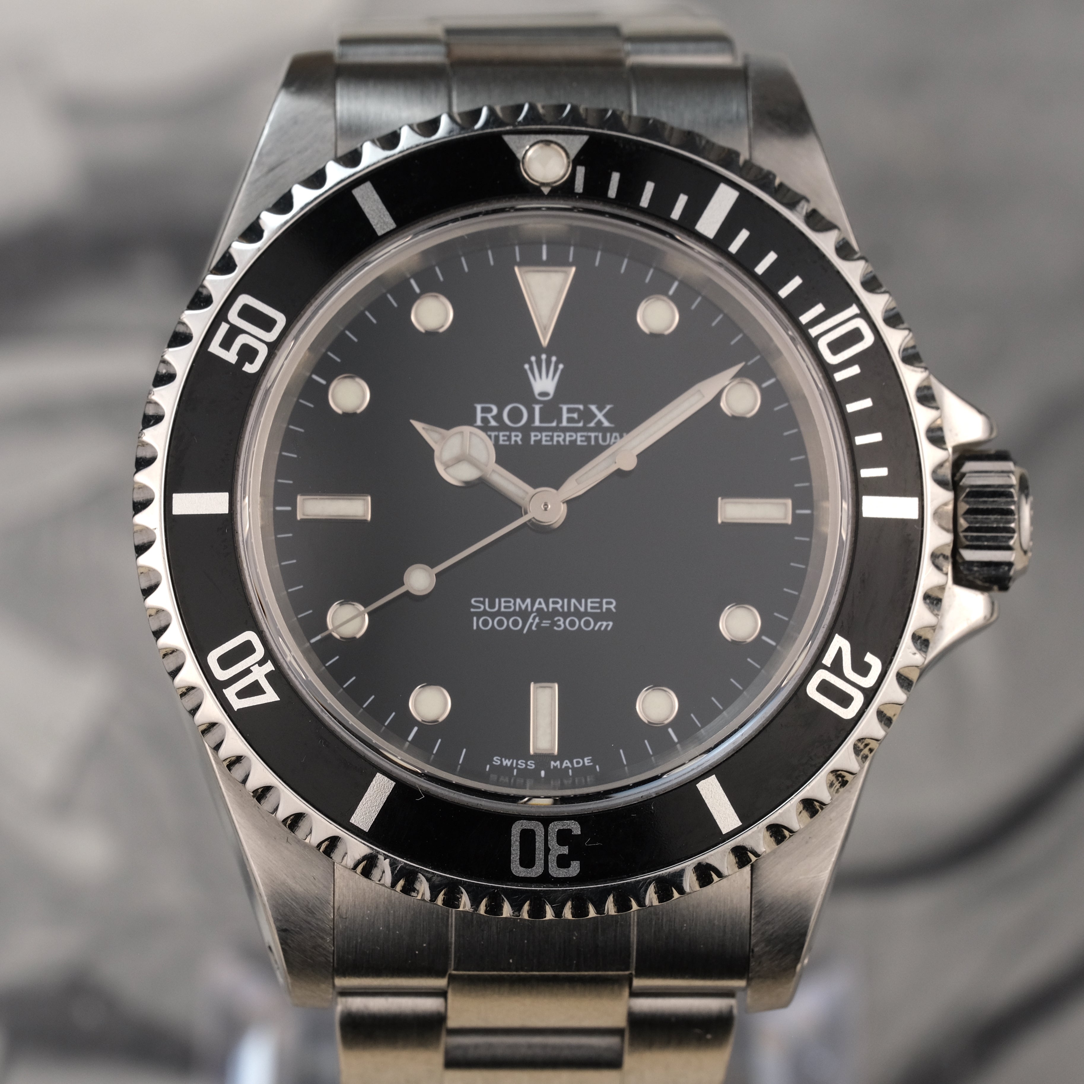 2002 Rolex Submariner 14060m with original papers – Bernstein Watch Co